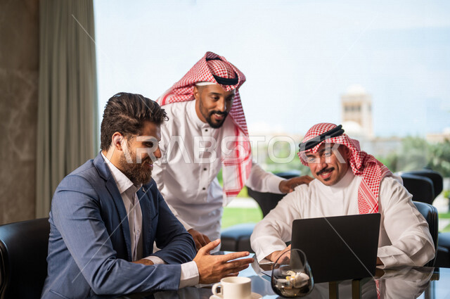 A Saudi Arabian Gulf work team with an Arab man wearing a formal suit ...