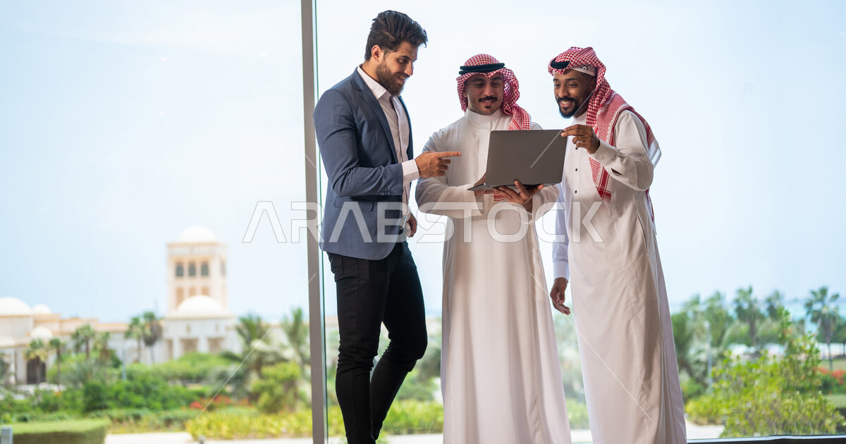 A Saudi team and a man in a formal suit at the company’s headquarters ...