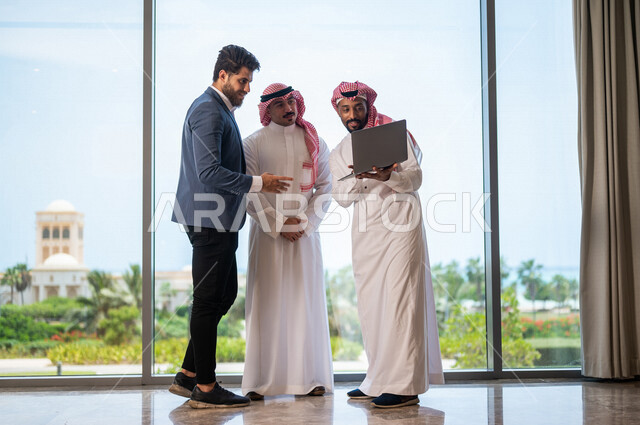 A Saudi team and a man in a formal suit at the company’s headquarters ...