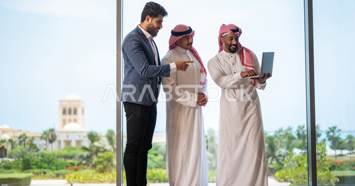A Saudi team and a man in a formal suit at the company’s headquarters ...
