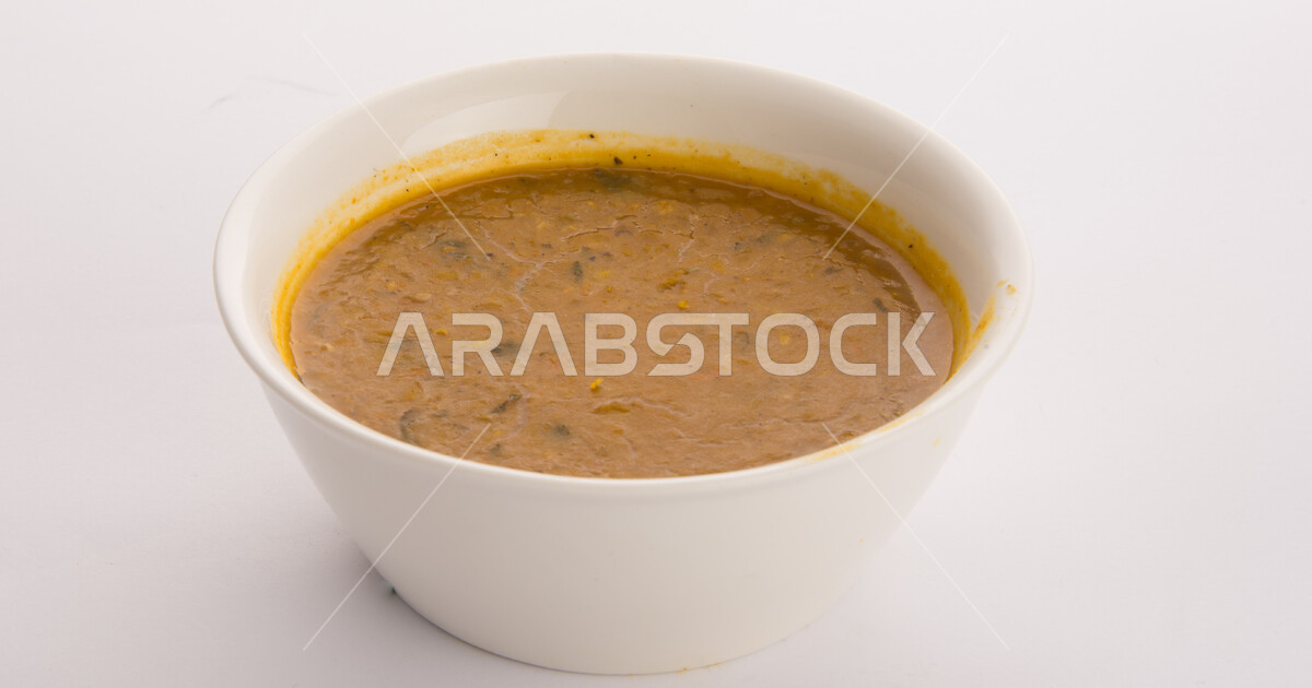 a plate of red lentil soup, edam lentils, a plate of red groats soup, a ...