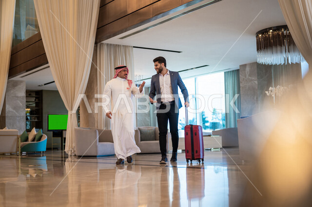 A Saudi Arabian Gulf businessman wearing a Saudi outfit with an Arab ...