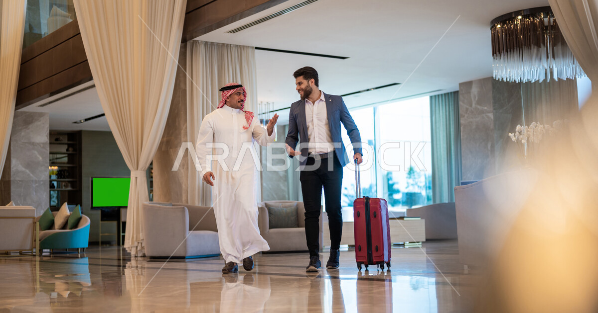 A Saudi Arabian Gulf businessman wearing a Saudi outfit with an Arab ...