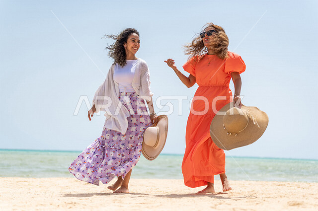 Two Saudi Arabian Gulf friends enjoying their summer vacation on the ...
