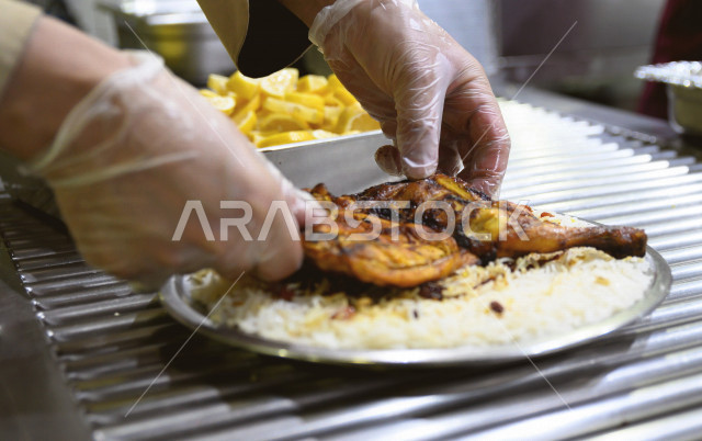 Traditional Saudi Arabian and Gulf foods ready to be served, preparing ...