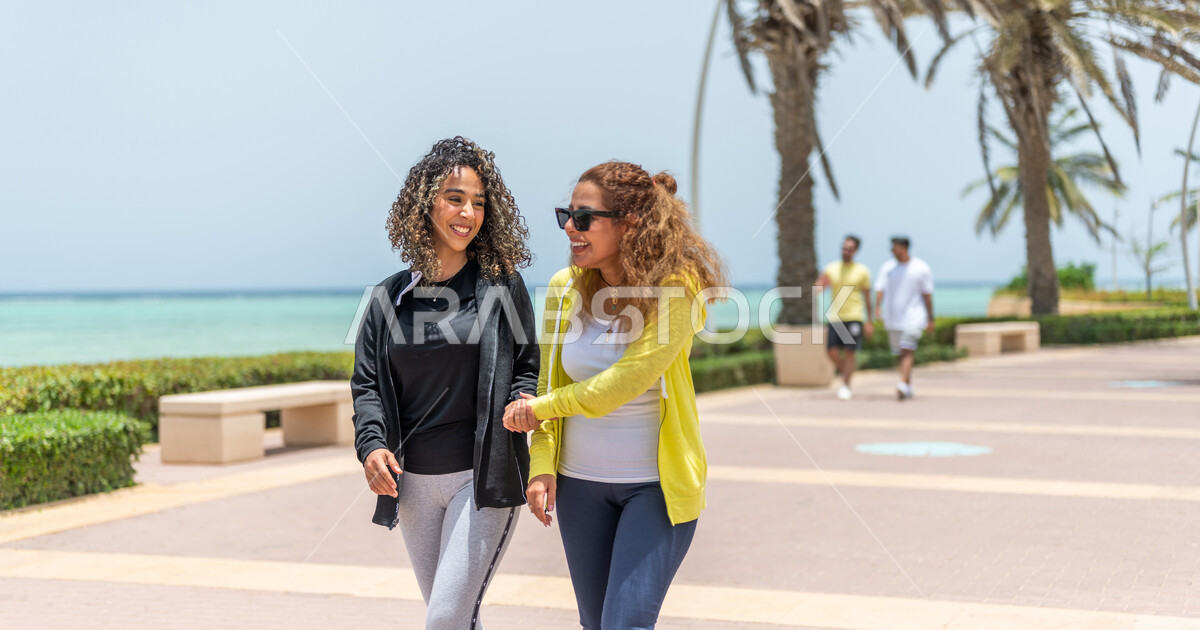 Two Saudi Arabian Gulf friends practicing walking on the Jeddah ...