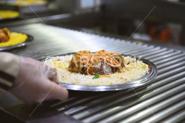 Traditional Saudi Arabian and Gulf foods ready to be served, preparing ...