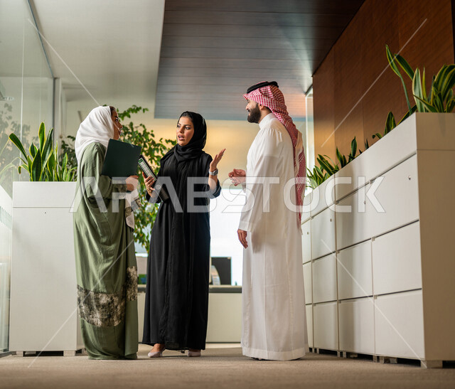 A Saudi work team inside the company’s headquarters, a meeting of ...