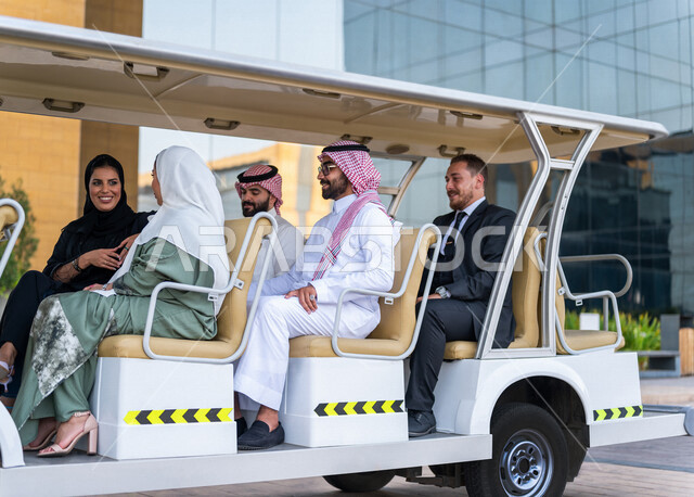 A group of Saudi Arab people inside an electric car specialized in ...