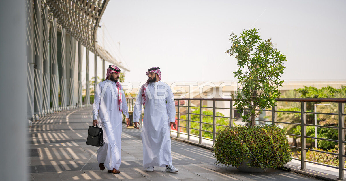 Saudi Arabian Gulf businessmen, friends at work, work team ...