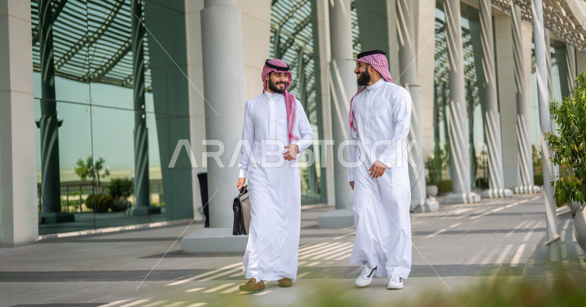 Saudi Arabian Gulf businessmen, friends at work, work team ...