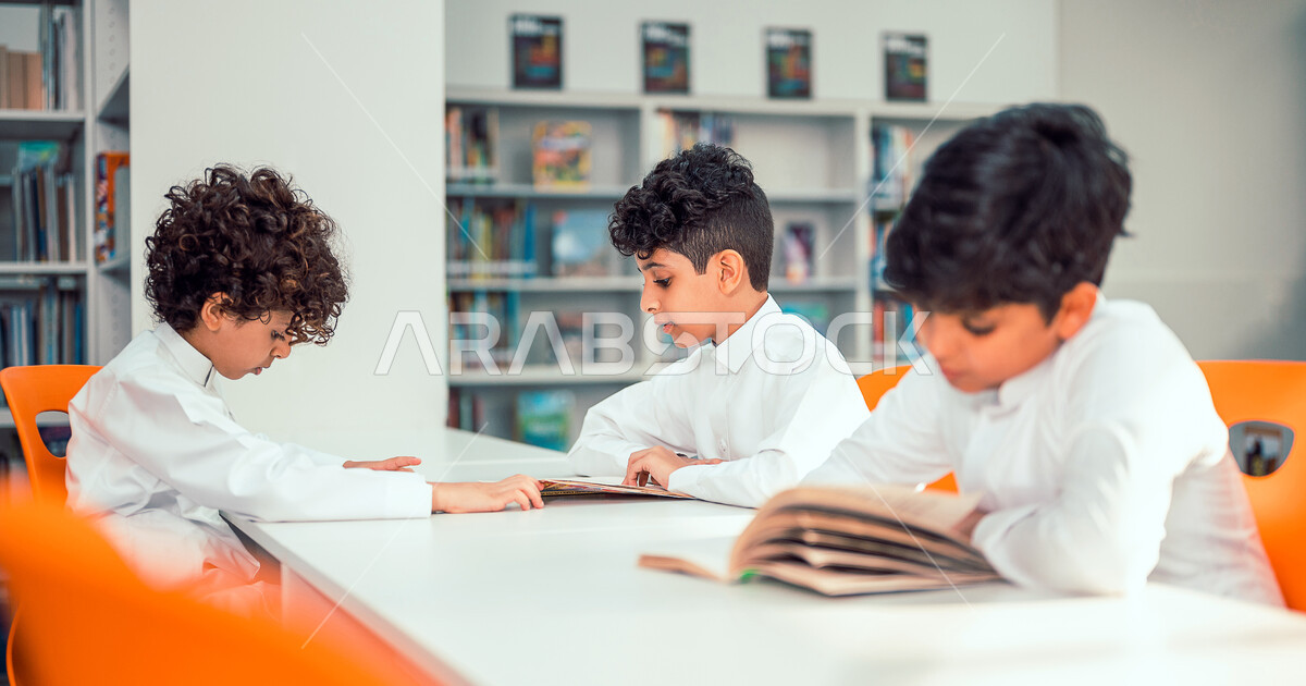 Saudi Arabian Gulf students sitting in the school library, enjoying ...