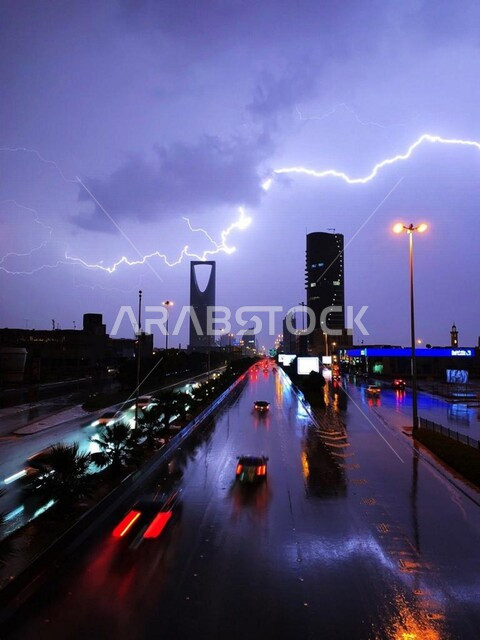 Streets and roads of Riyadh at night, spark of lightning in the sky ...