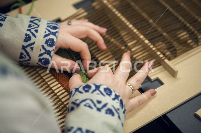 Close-up of a woman's hand doing some work and handicrafts, art and ...