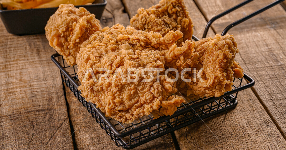 Close-up of crispy fried chicken pieces, delicious broasted chicken ...