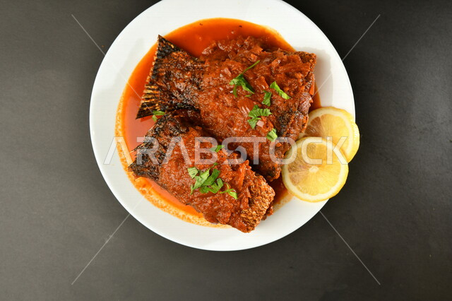 Close-up of a delicious cooked fish dish, traditional Arabic food, fish ...
