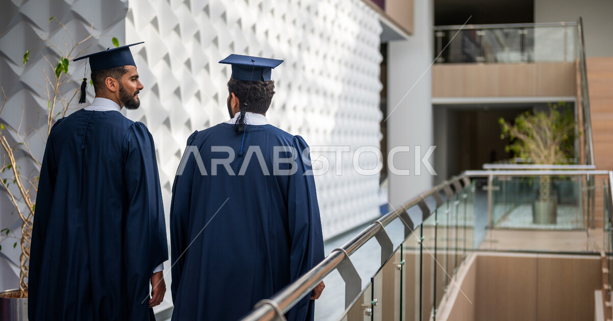 A picture from the back of two Saudi Arabian Gulf students wearing the ...