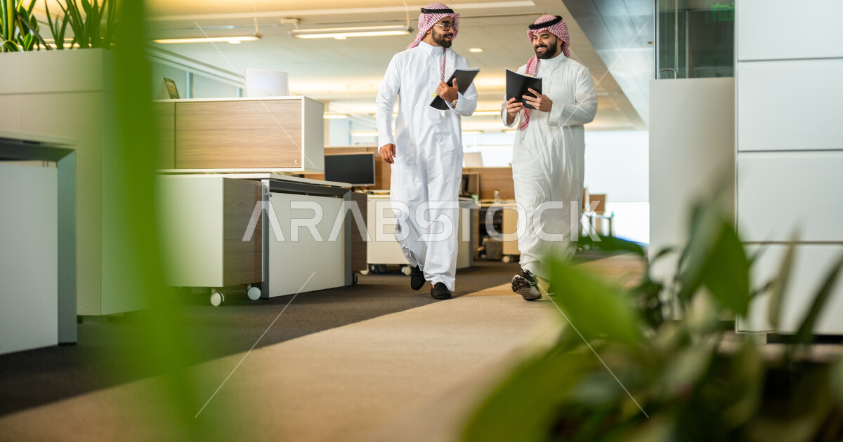 Two Saudi Arabian Gulf employees inside the company’s headquarters ...