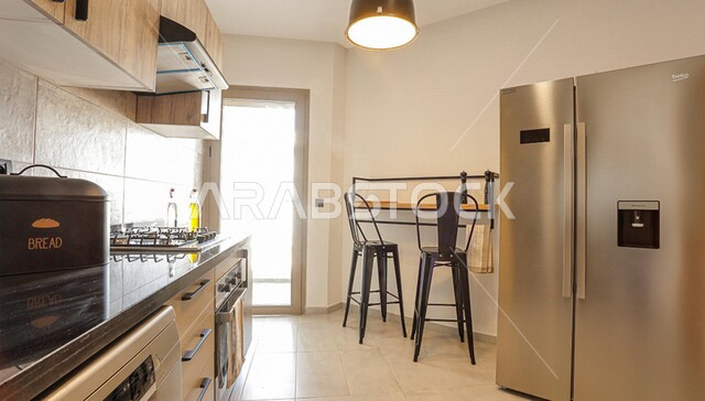 Kitchen in a residential apartment with modern and attractive designs ...