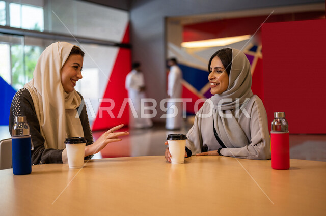 A close-up photo of two Saudi Arabian Gulf students in the university ...