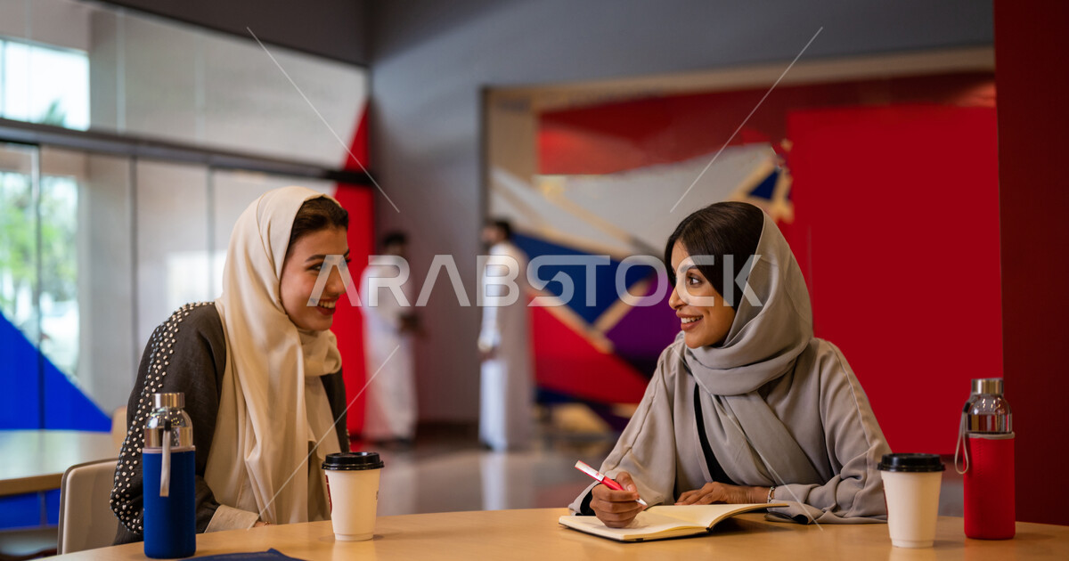 A close-up photo of two Saudi Arabian Gulf students in the university ...