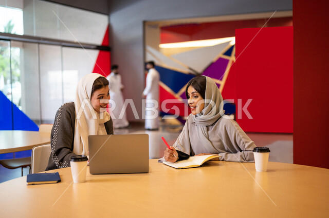 A close-up photo of two Saudi Arabian Gulf students in the university ...