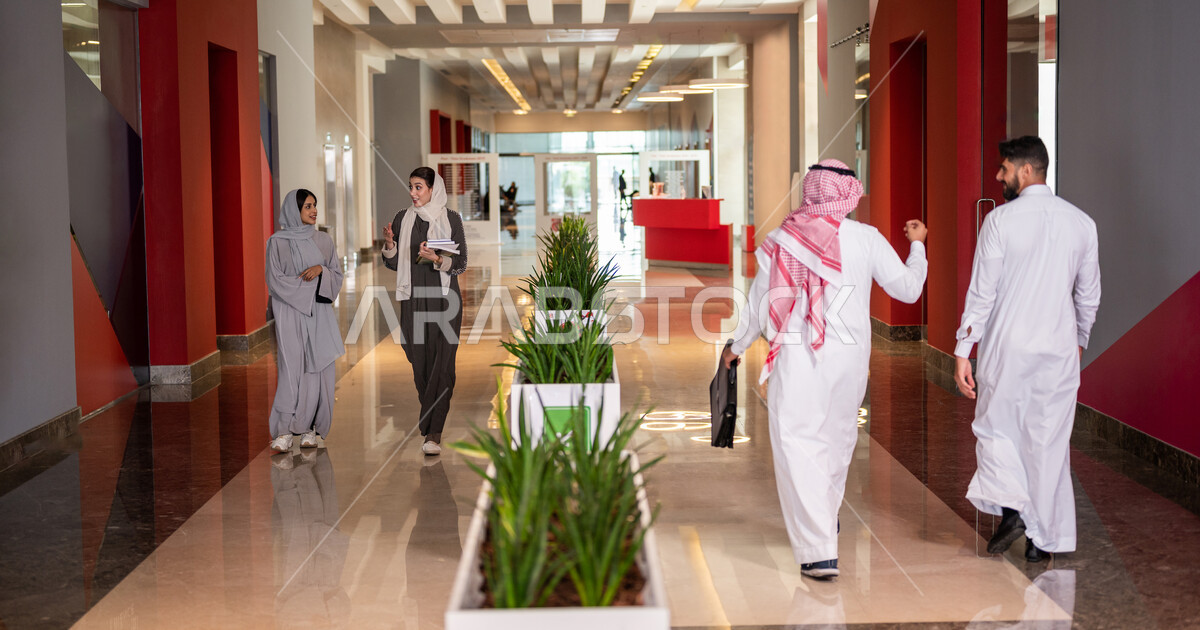 Arab Saudi Gulf university students in the university lobby, touring ...