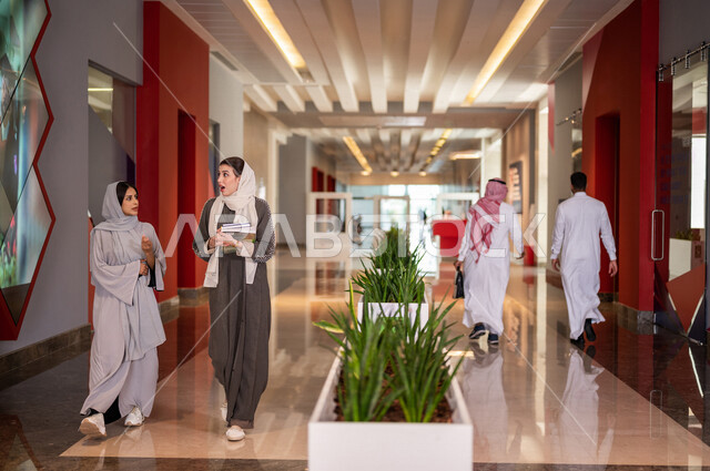 Arab Saudi Gulf university students in the university lobby, touring ...