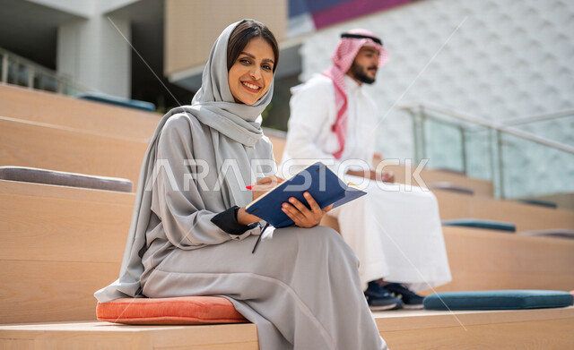 Close-up picture of Saudi Arab Gulf university students in the lecture hall at the university ...
