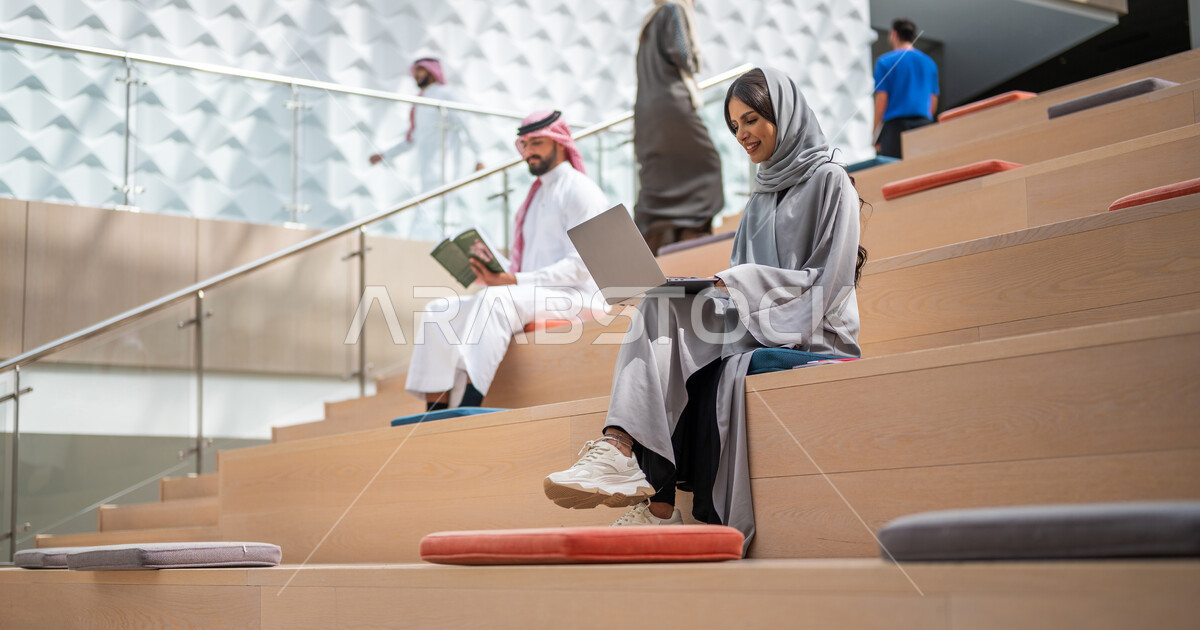 Saudi Arab Gulf university students in the university lecture hall, listening to the lecture ...