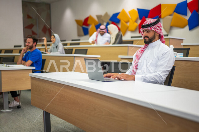 Arab Saudi Gulf university students in the lecture hall at the university, interaction and ...