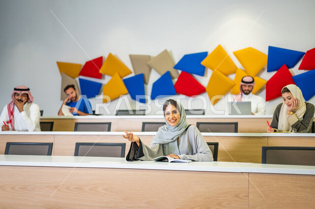 Arab Saudi Gulf university students in the lecture hall at the university, interaction and ...