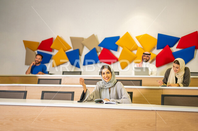 Arab Saudi Gulf university students in the lecture hall at the university, interaction and ...
