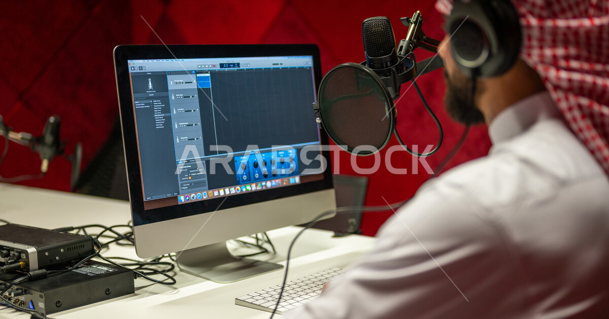 A close-up of the back of a Saudi Arabian Gulf radio reporter in the ...