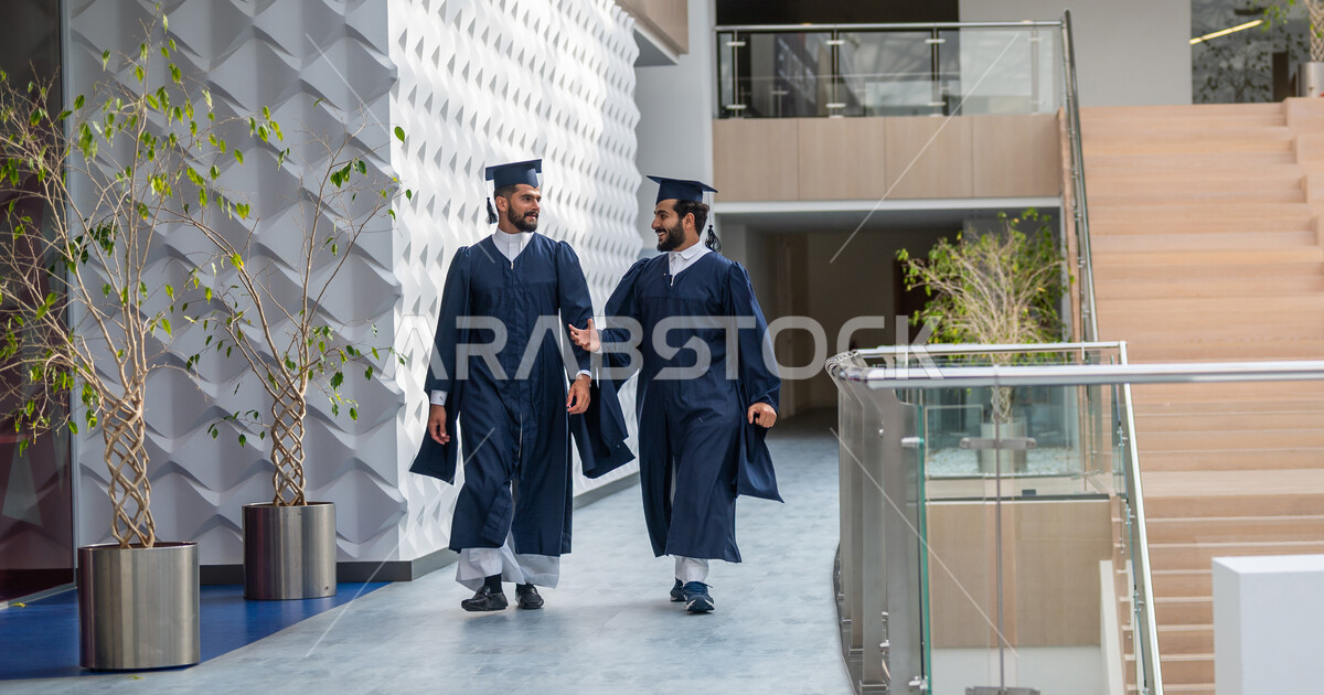 Two Saudi Arabian Gulf students wearing the abaya and graduation cap ...