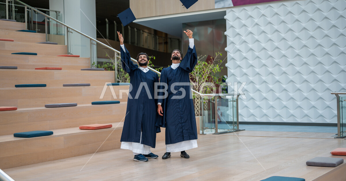 Two Saudi Arabian Gulf students wearing an abaya and graduation cap ...