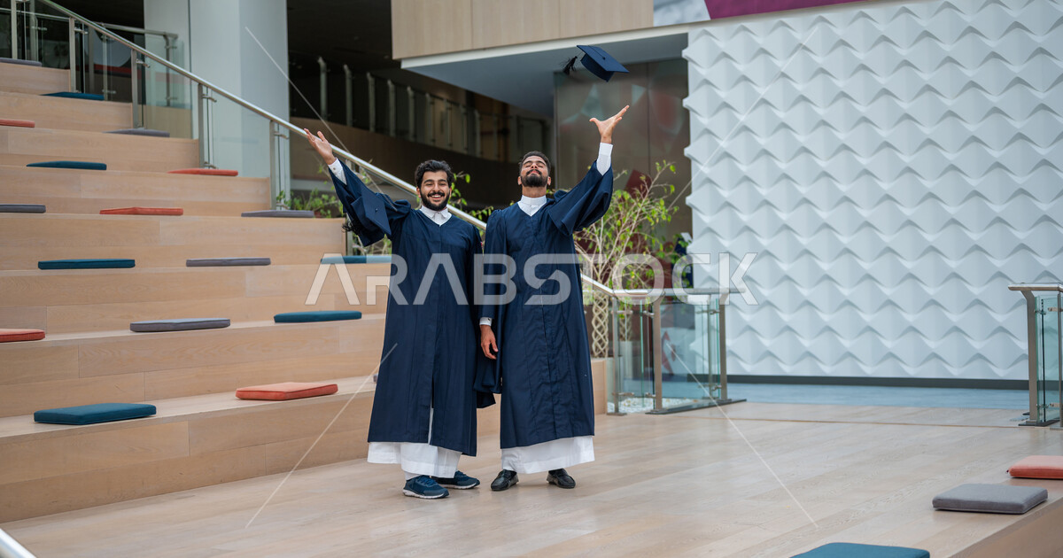 Two Saudi Arabian Gulf students wearing an abaya and graduation cap ...