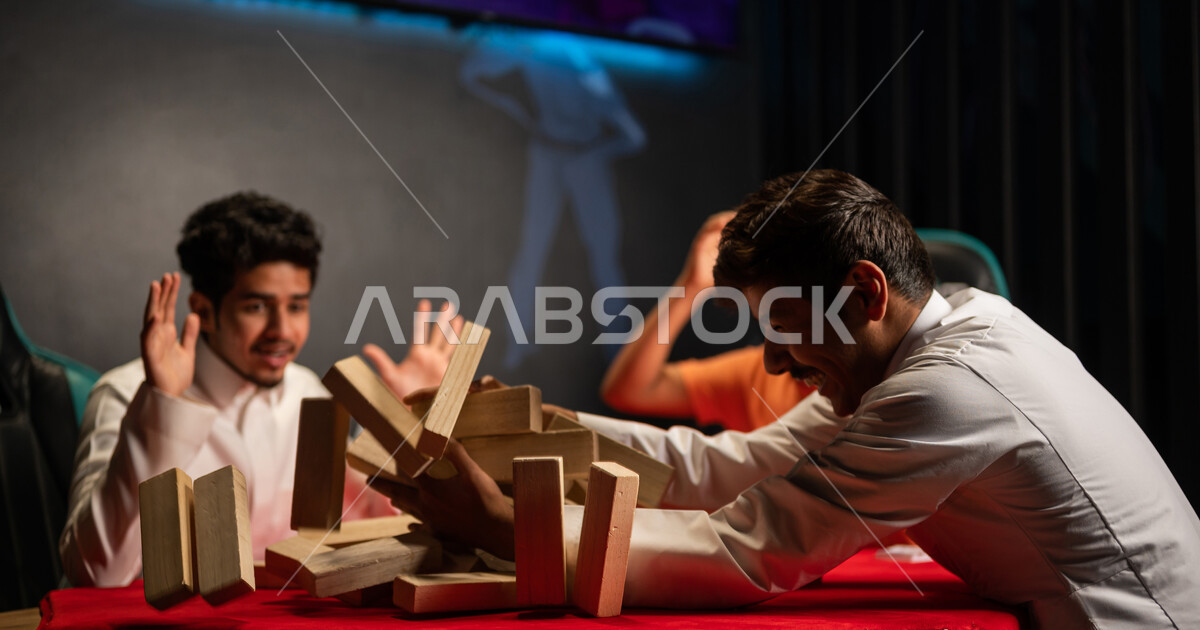 A close-up of a group of young Saudi Arabian Gulf teenagers playing ...
