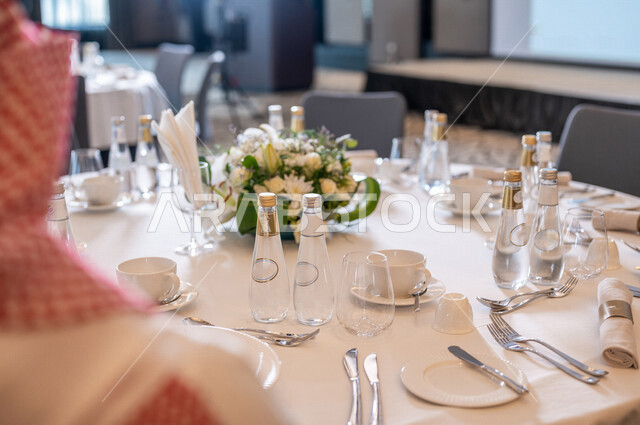 Close-up of a Saudi Arabian Gulf man sitting at the dining table inside ...