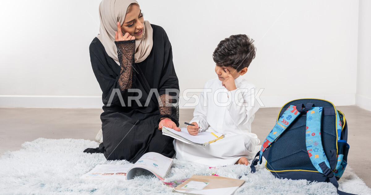A Saudi Gulf Arab mother helps her child learn at home, educational ...