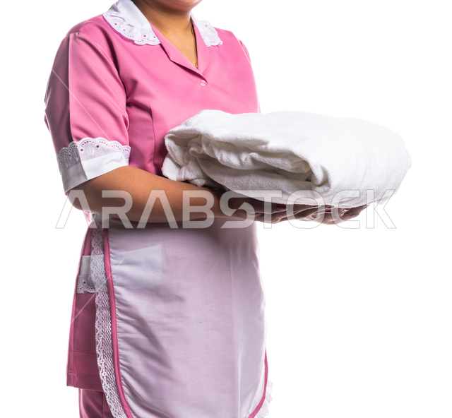 Close-up portrait of a cleaning lady wearing an apron, holding a clean ...