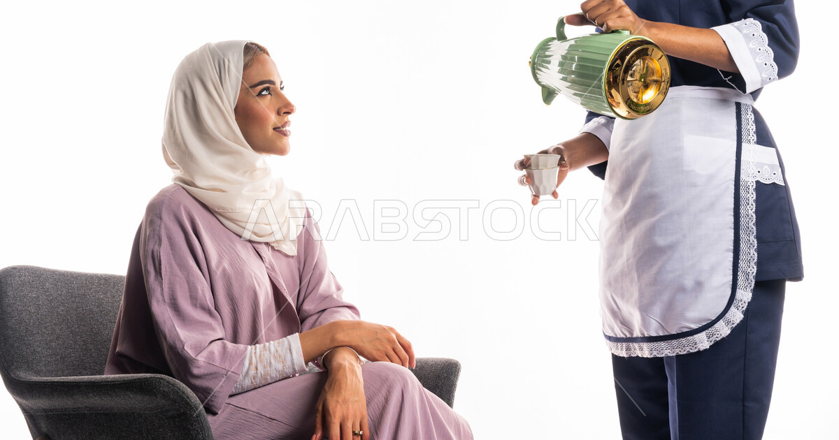 Close-up portrait of a cleaning lady wearing an apron, serving coffee ...