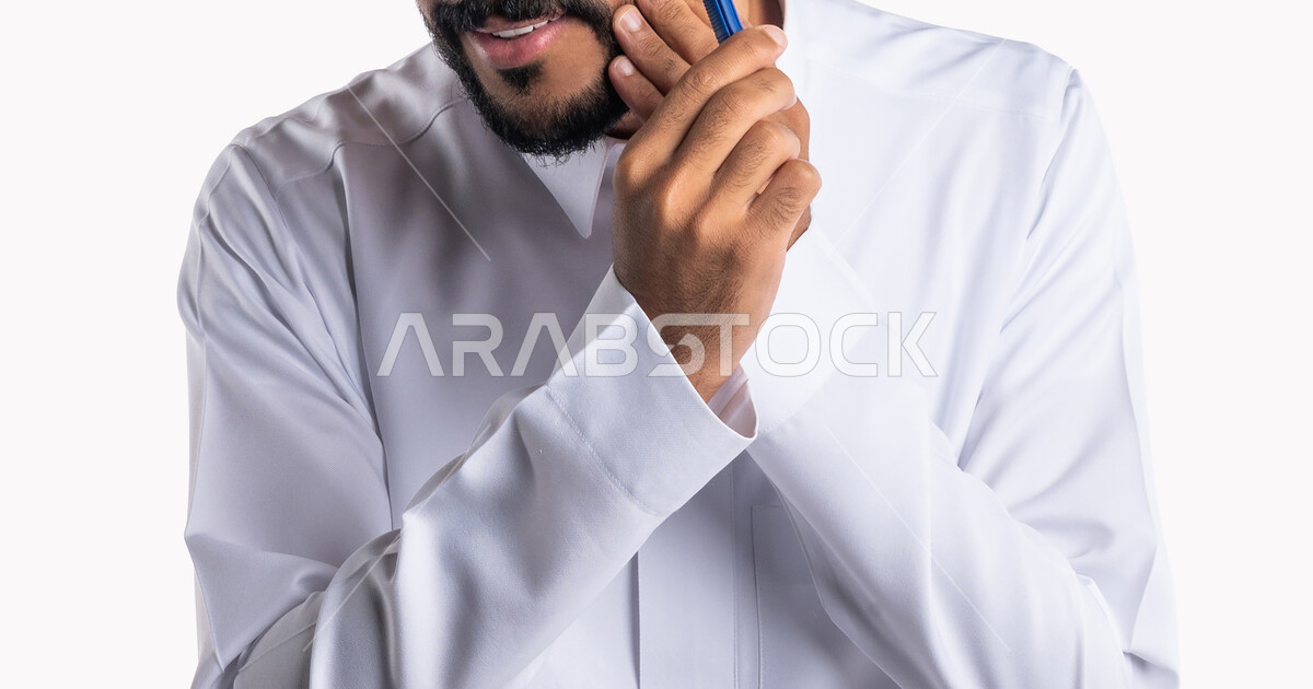Close-up portrait of a Saudi Arabian Gulf man, removing facial hair ...