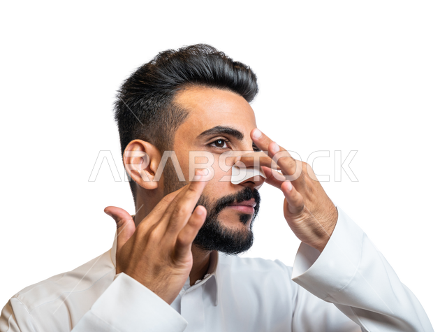 Portrait of a Saudi Arabian Gulf man, who puts nose pads to get rid of ...