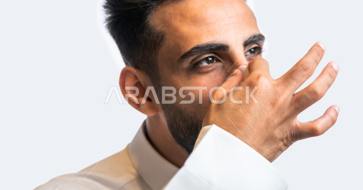 Portrait of a Saudi Arabian Gulf man, who puts nose pads to get rid of ...