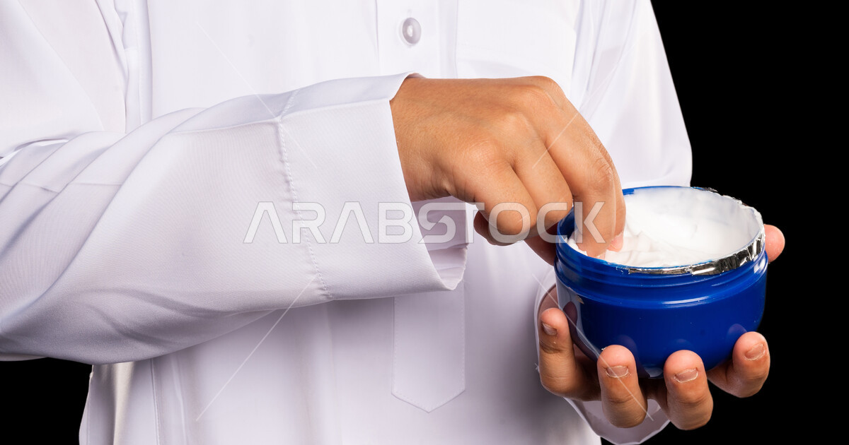 Close-up portrait of a Saudi Arabian Gulf boy wearing the Saudi dress ...