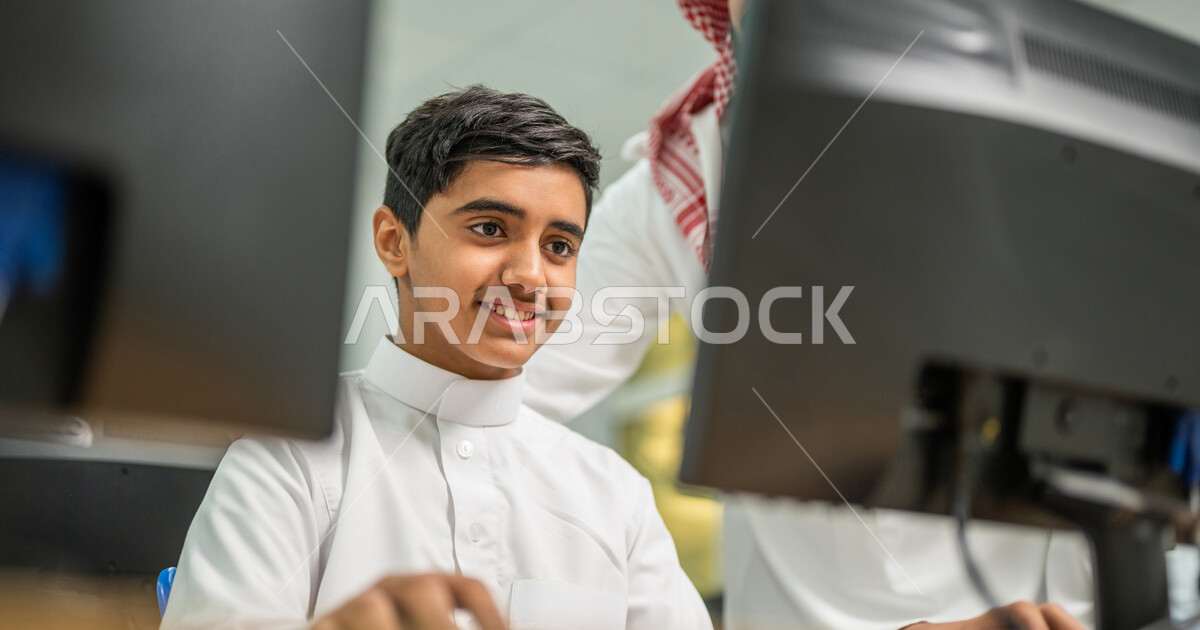 A close-up of a Saudi Arabian Gulf teacher in the computer lab ...