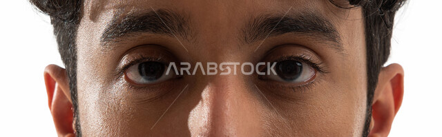 A close-up of the eye of a Saudi Arab Gulf youth, a portrait of an Arab ...
