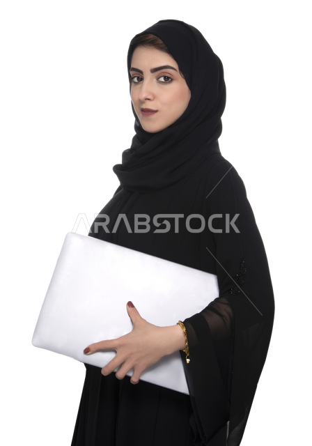 Portrait of an Emirati woman working on a laptop, Emirati company, Gulf ...