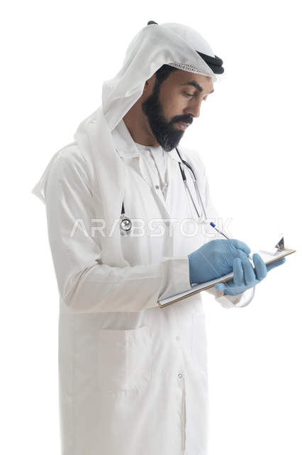 Portrait of an Arab Gulf Emirati doctor in traditional attire putting ...